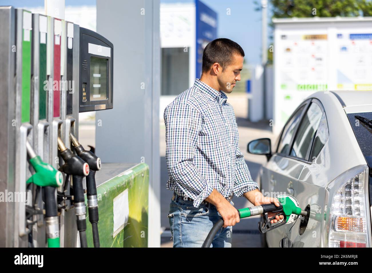 Man filling up tank of his car with gasoline Stock Photo - Alamy
