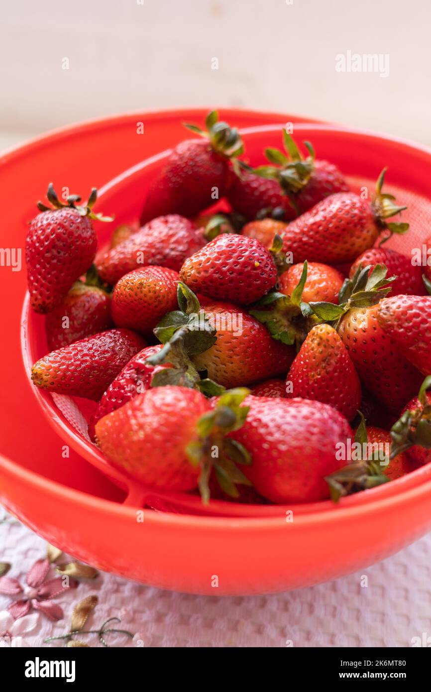 strawberry texture details, tropical fruits being washed to prepare ...