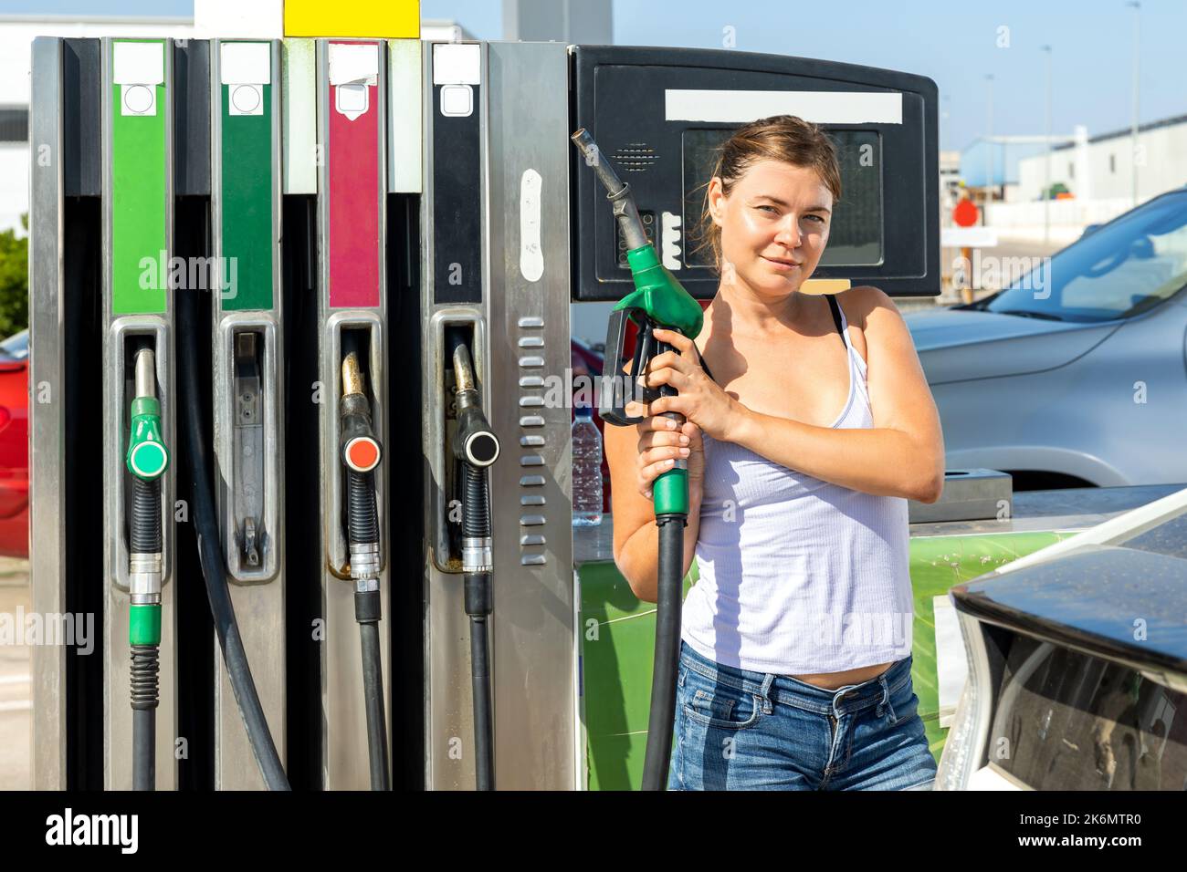 Woman filling up tank hi-res stock photography and images - Alamy