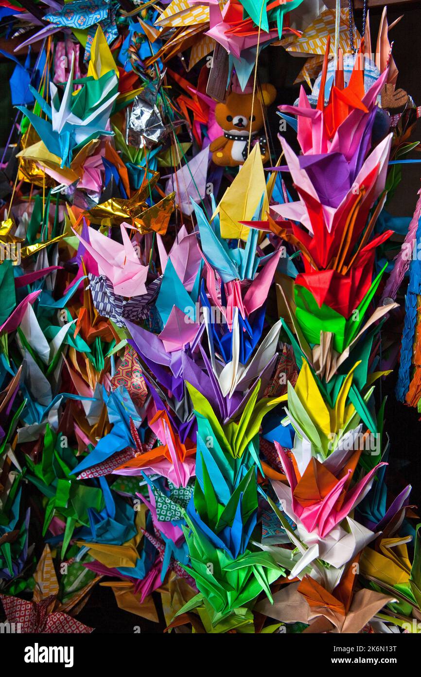 Strings of paper origami cranes Temple Ikegami Tokyo Japan Stock Photo ...