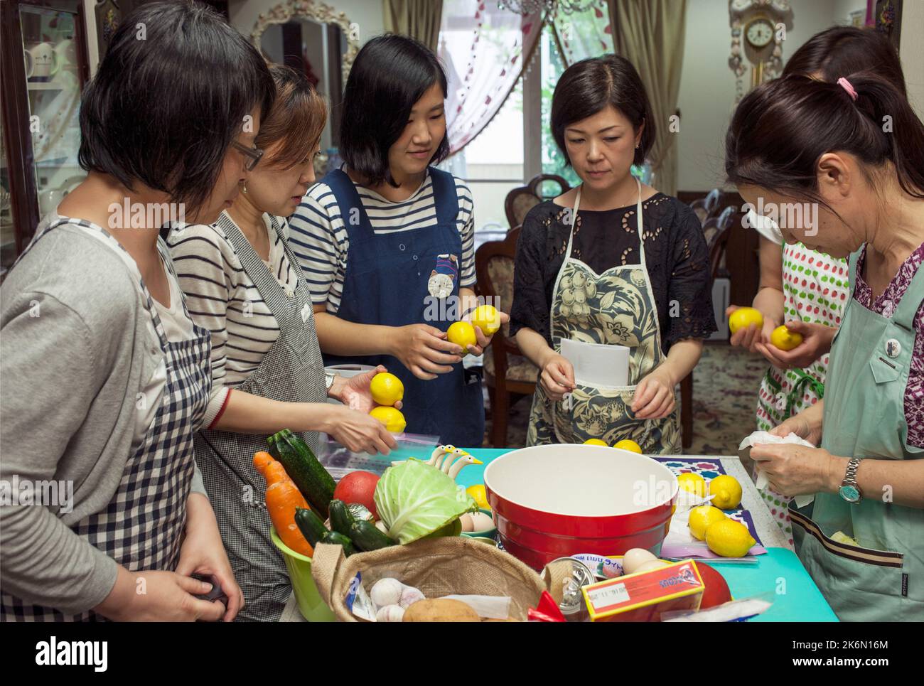 Students prepare salted lemons, Moroccan cooking class, Tokyo, Japan ...