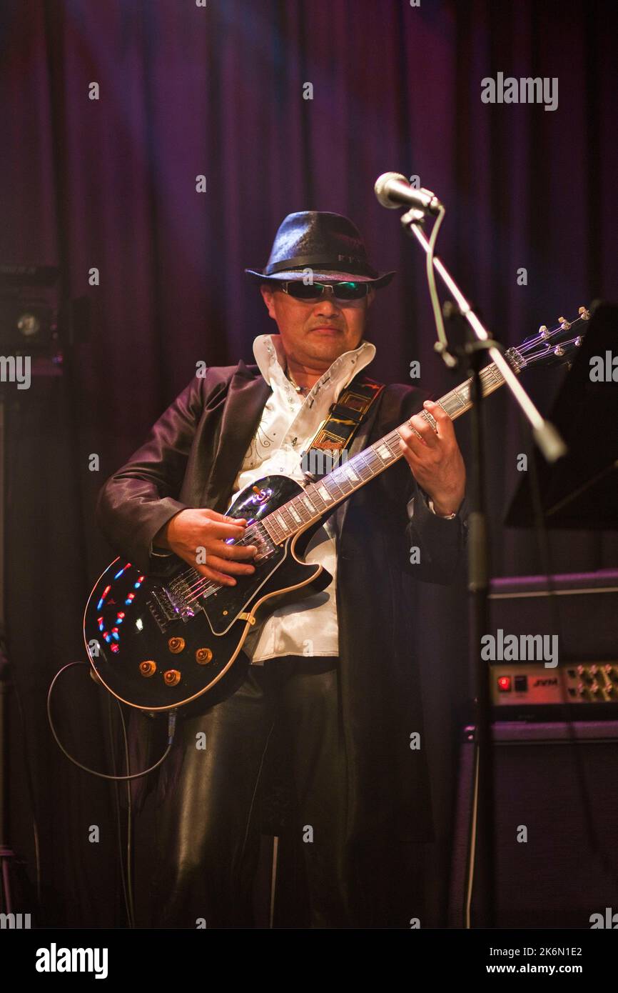Asian male musician performing solo hi-res stock photography and images ...