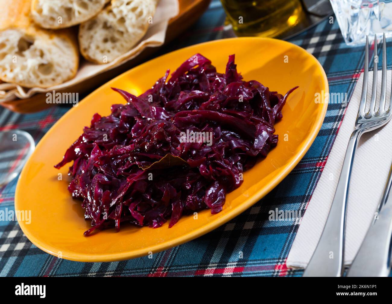 Braised red cabbage in orange plate Stock Photo - Alamy