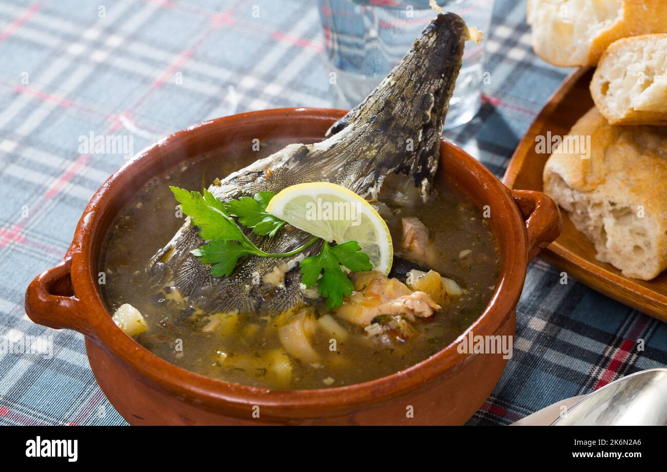 Fish soup with sturgeon in pottery Stock Photo - Alamy