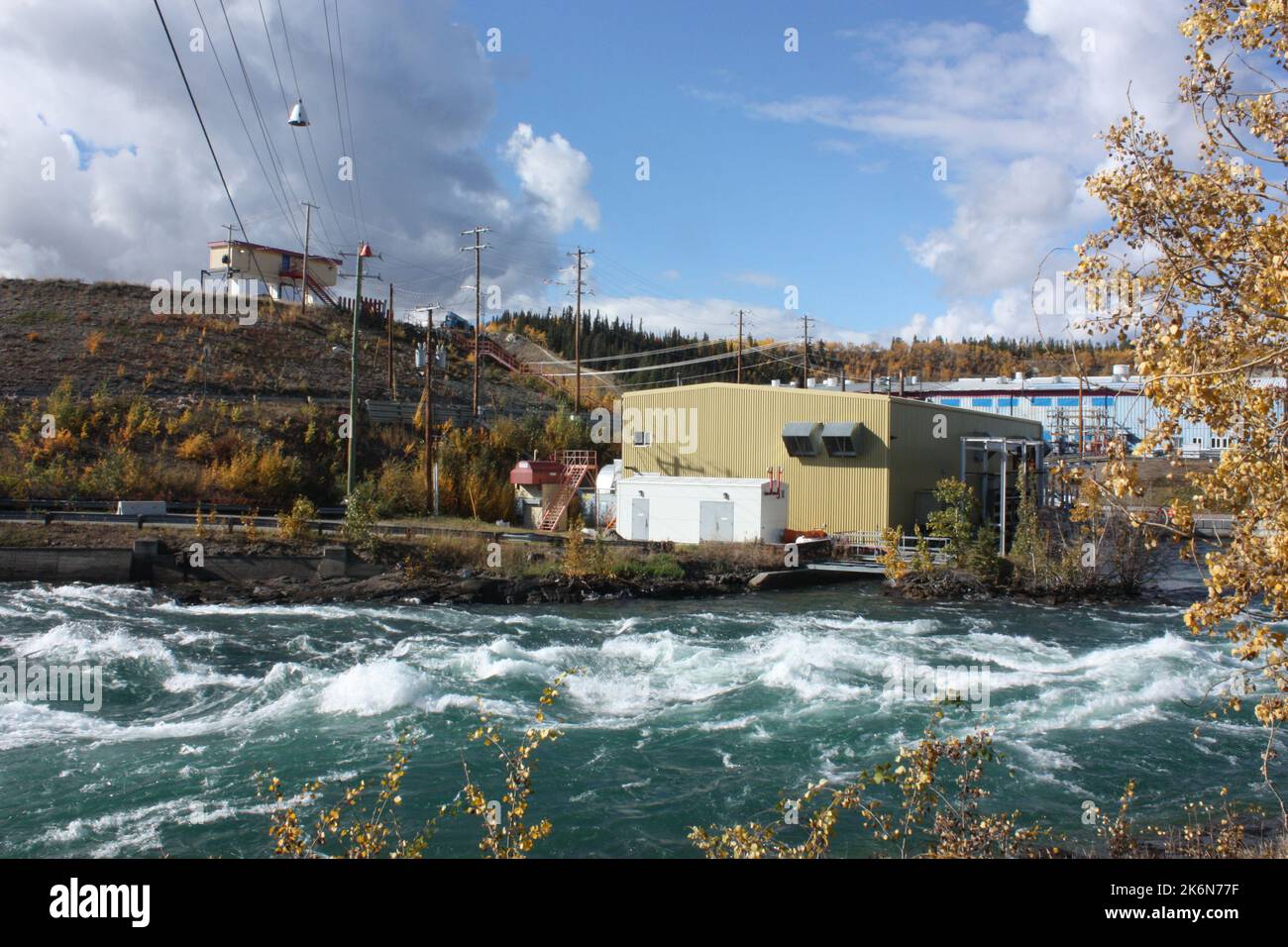The fast flowing Yukon River running past the hydroelectric power ...