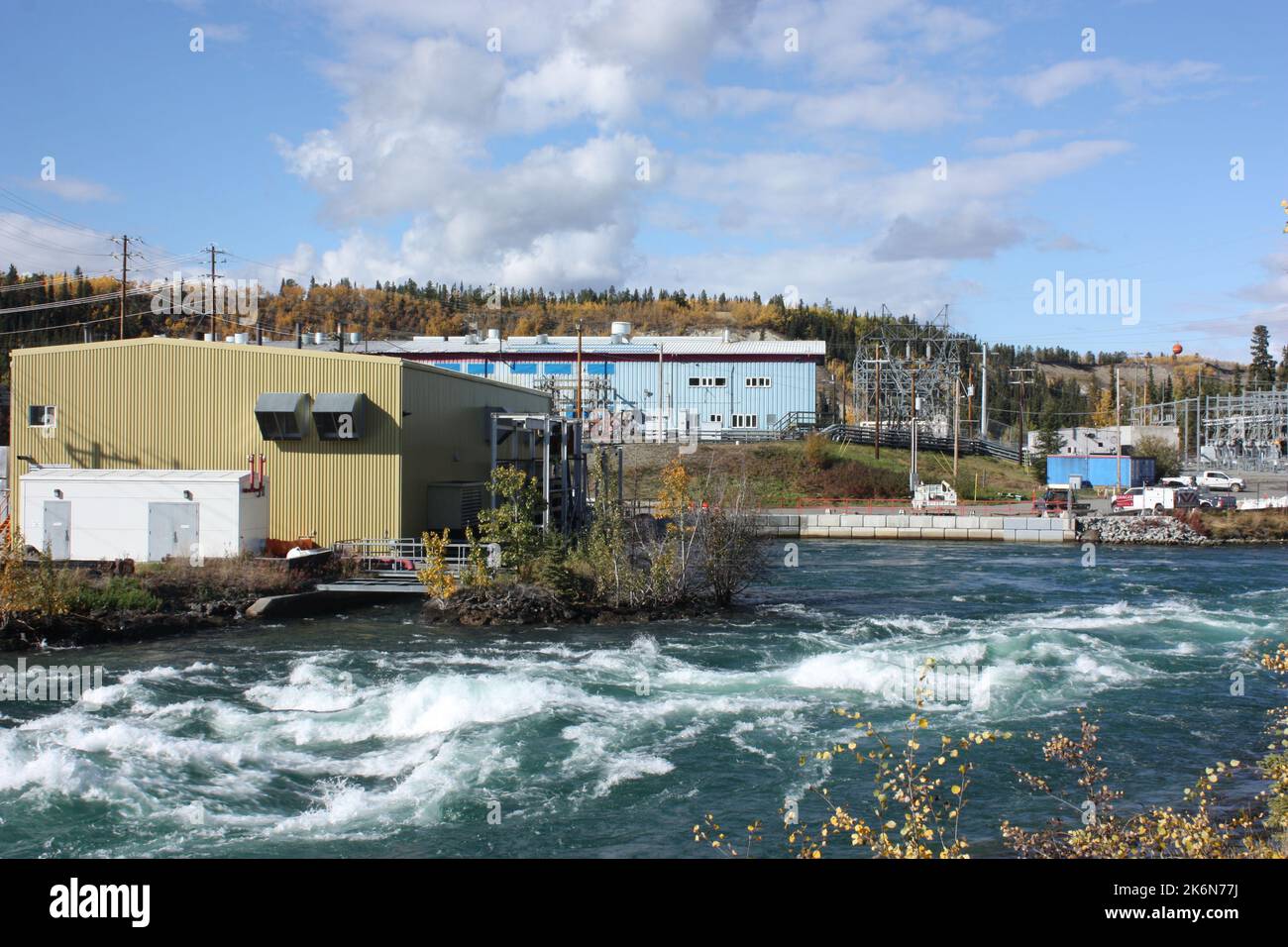 The fast flowing Yukon River running past the hydroelectric power ...
