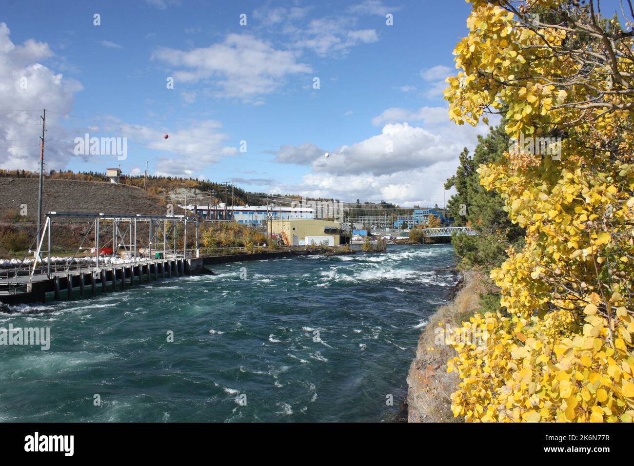 The fast flowing Yukon River running past the hydroelectric power ...