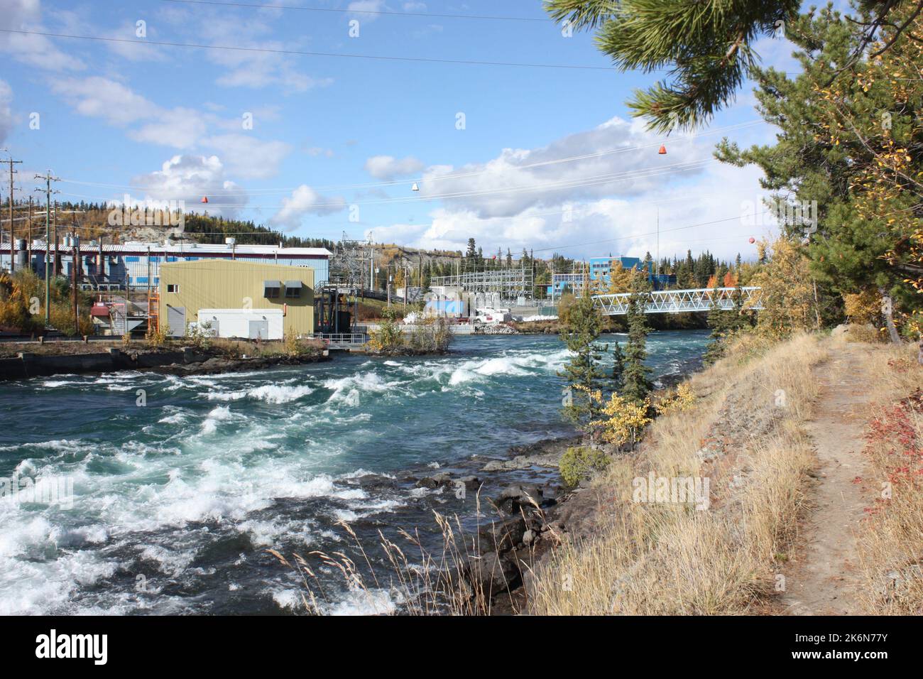The fast flowing Yukon River running past the hydroelectric power ...