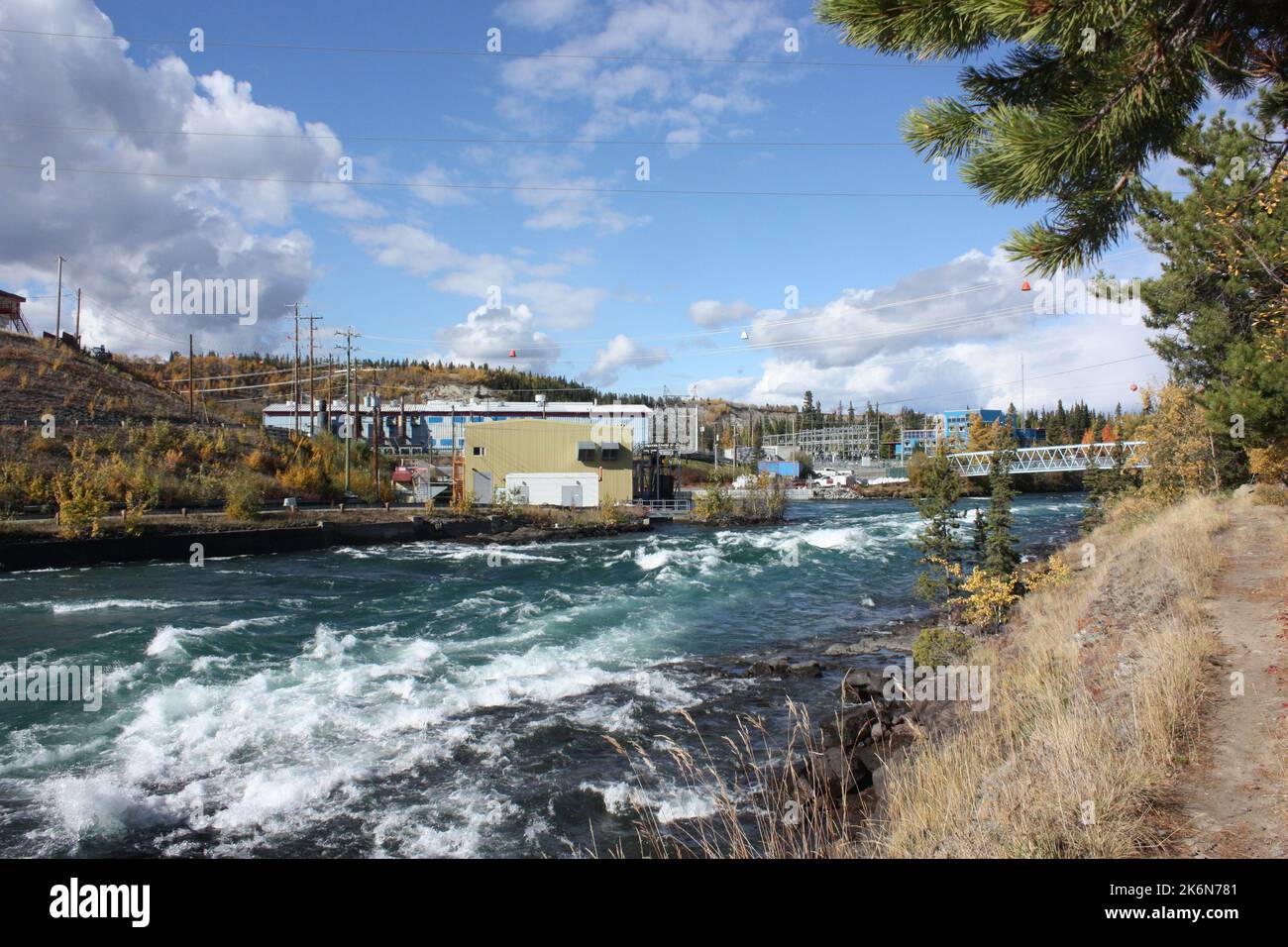 The fast flowing Yukon River running past the hydroelectric power ...