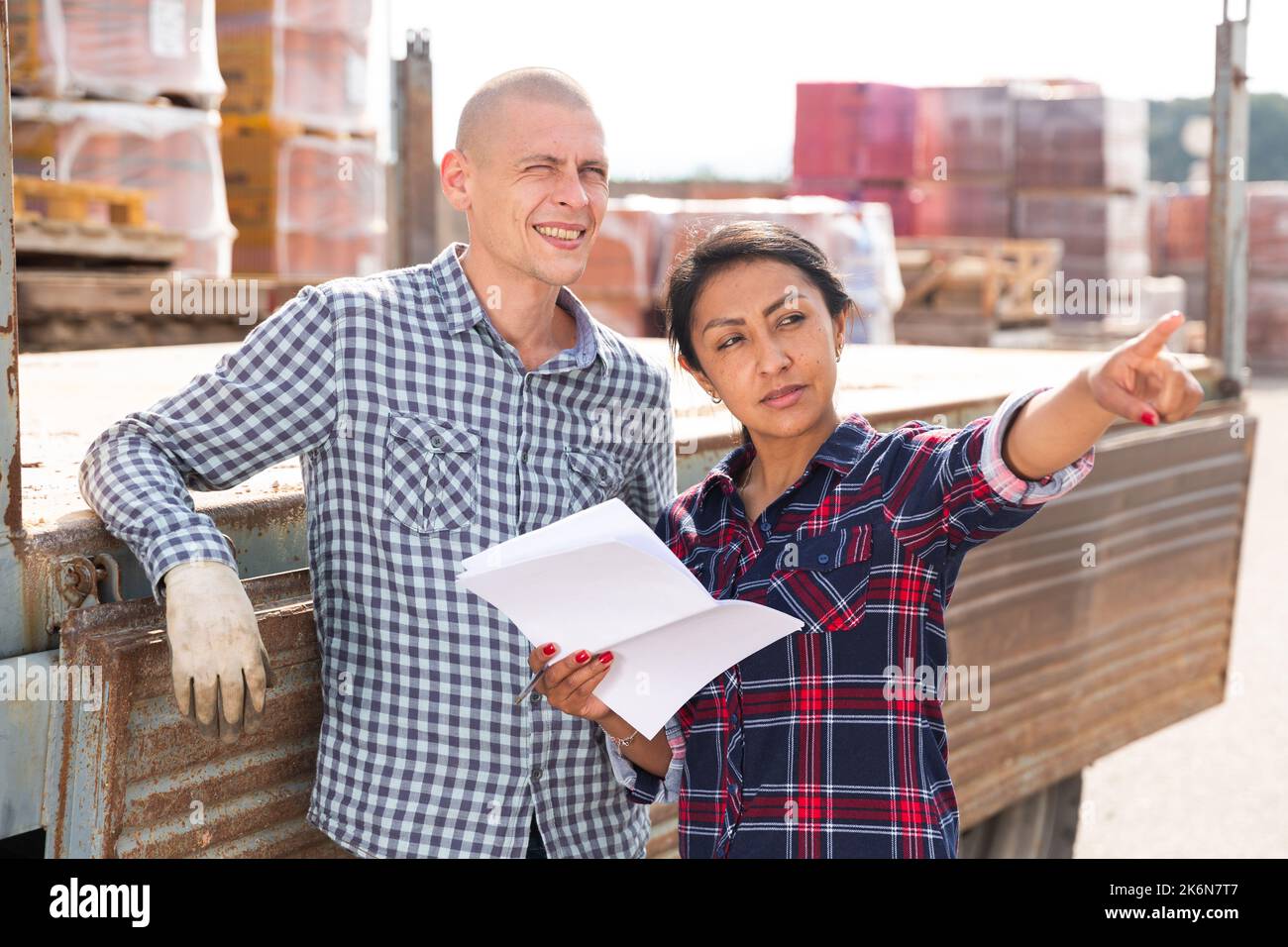 Couple of wokers checking order at hardware store warehouse Stock Photo ...