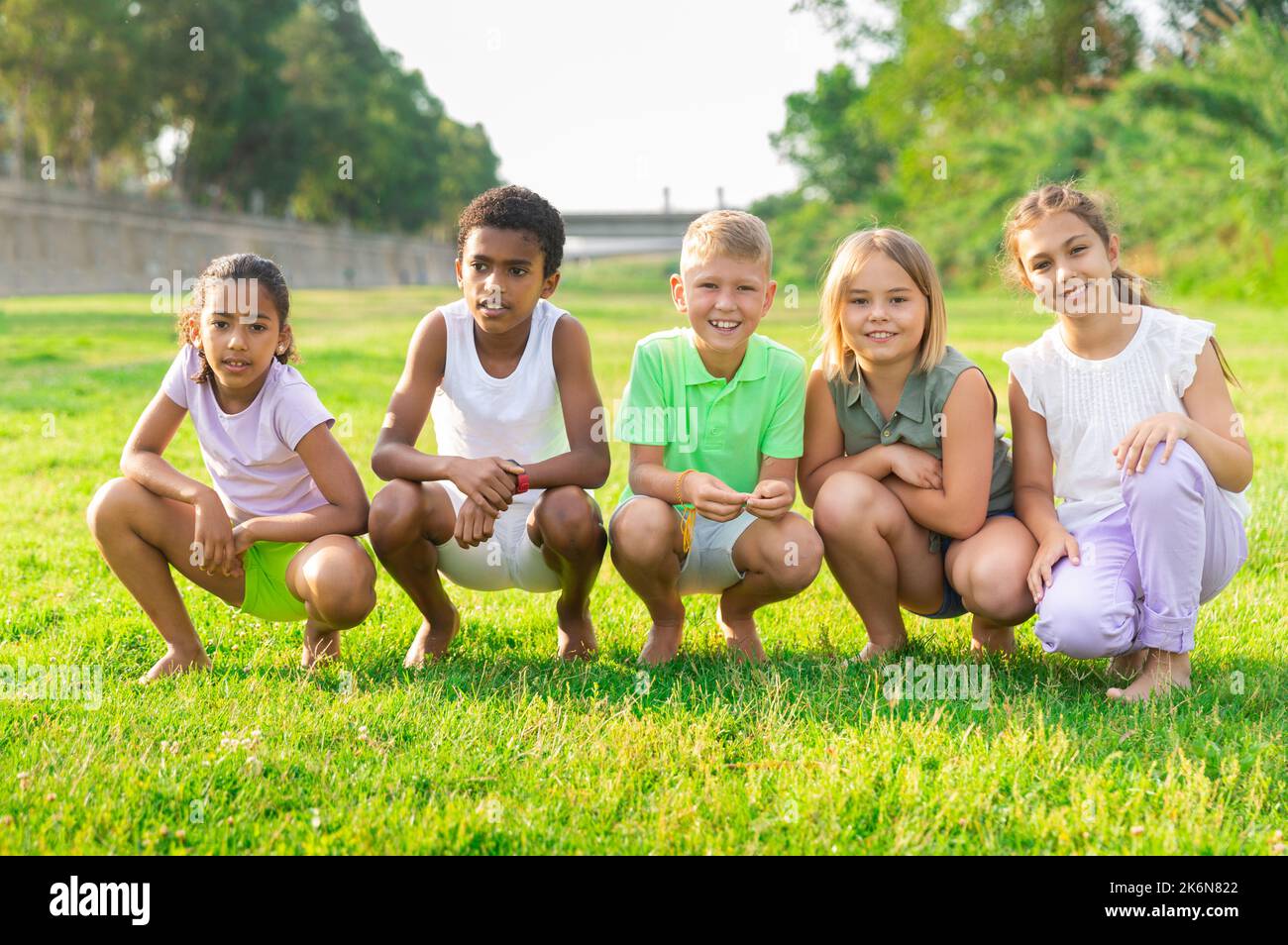 Children on grass Stock Photo - Alamy