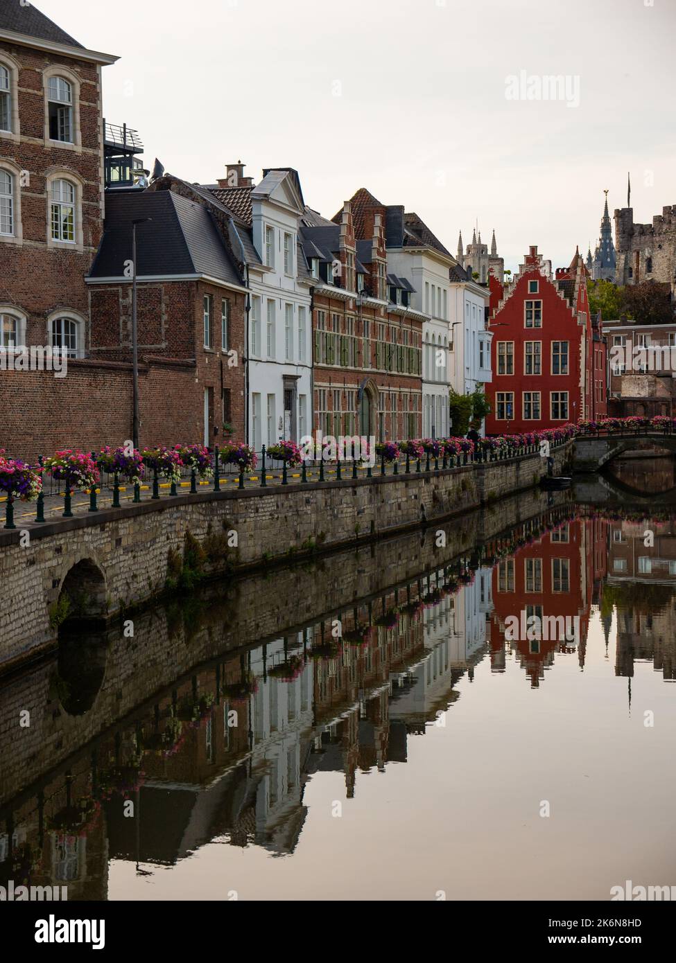 Medieval buildings in historical center of Ghent reflecting in water of ...