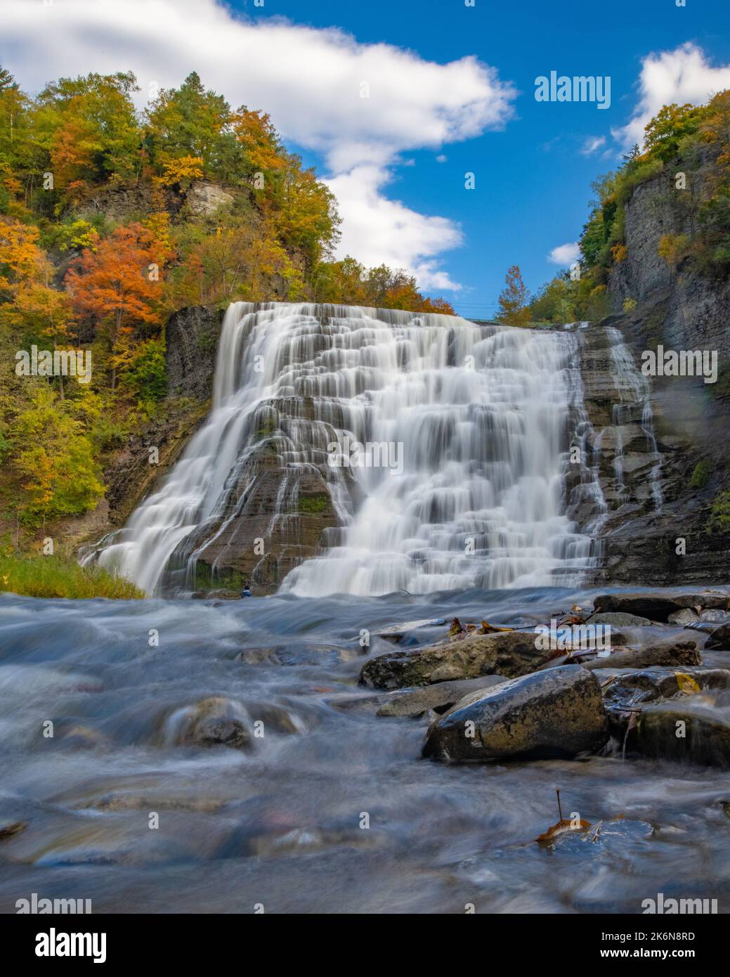 Ithaca Falls with fisherman wading in current - New York State with ...