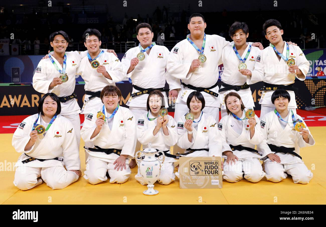 Members of Japan's mixed team pose with their gold medals at the judo ...