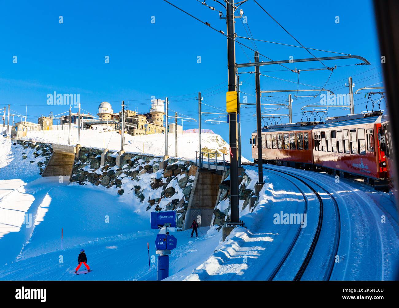 Train on mountain railway at Swiss Alps Stock Photo - Alamy