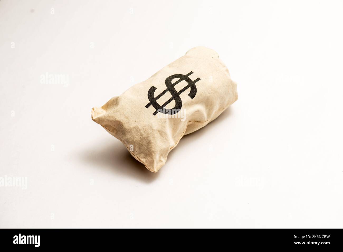 Dollar money bag isolated on white background Stock Photo - Alamy
