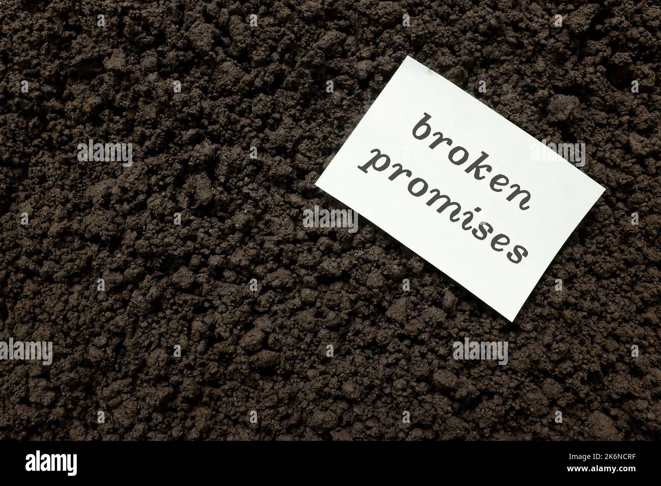 Broken promises concept. Paper note in dark soil background Stock Photo ...