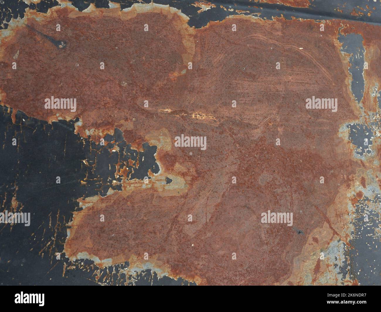 Brown rust stain on the black with blue with green with gray and silver ...