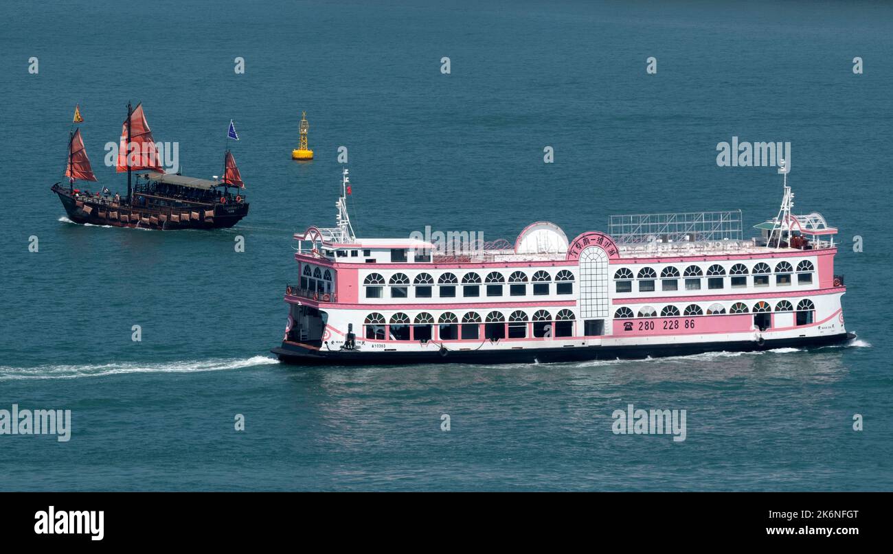 Traditional Chinese junk and tourist ferry, Victoria harbor, Hong Kong ...