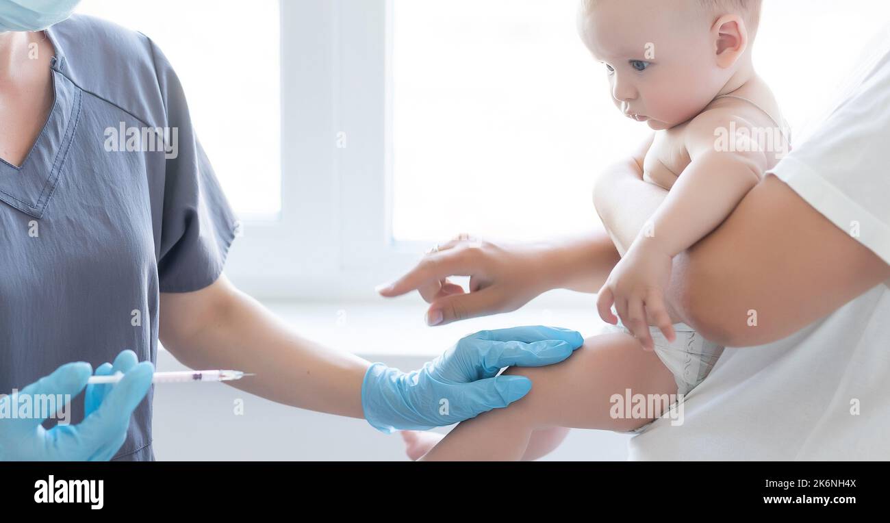 The doctor makes a baby vaccination on a white background Stock Photo ...