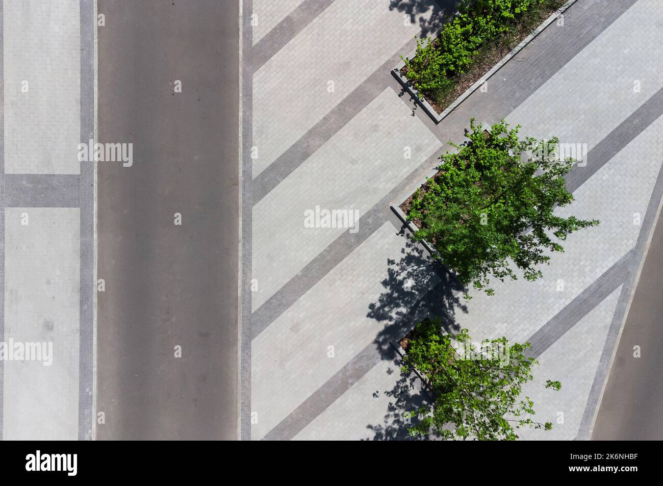 aerial top view of street with parking lot near new residential housing ...