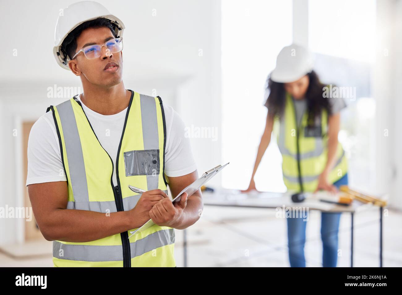 Do we need more supplies. a handsome young contractor standing inside ...