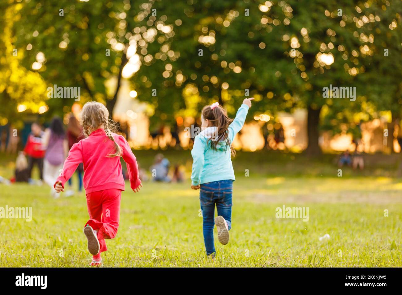 two little friends girls in the field Stock Photo - Alamy