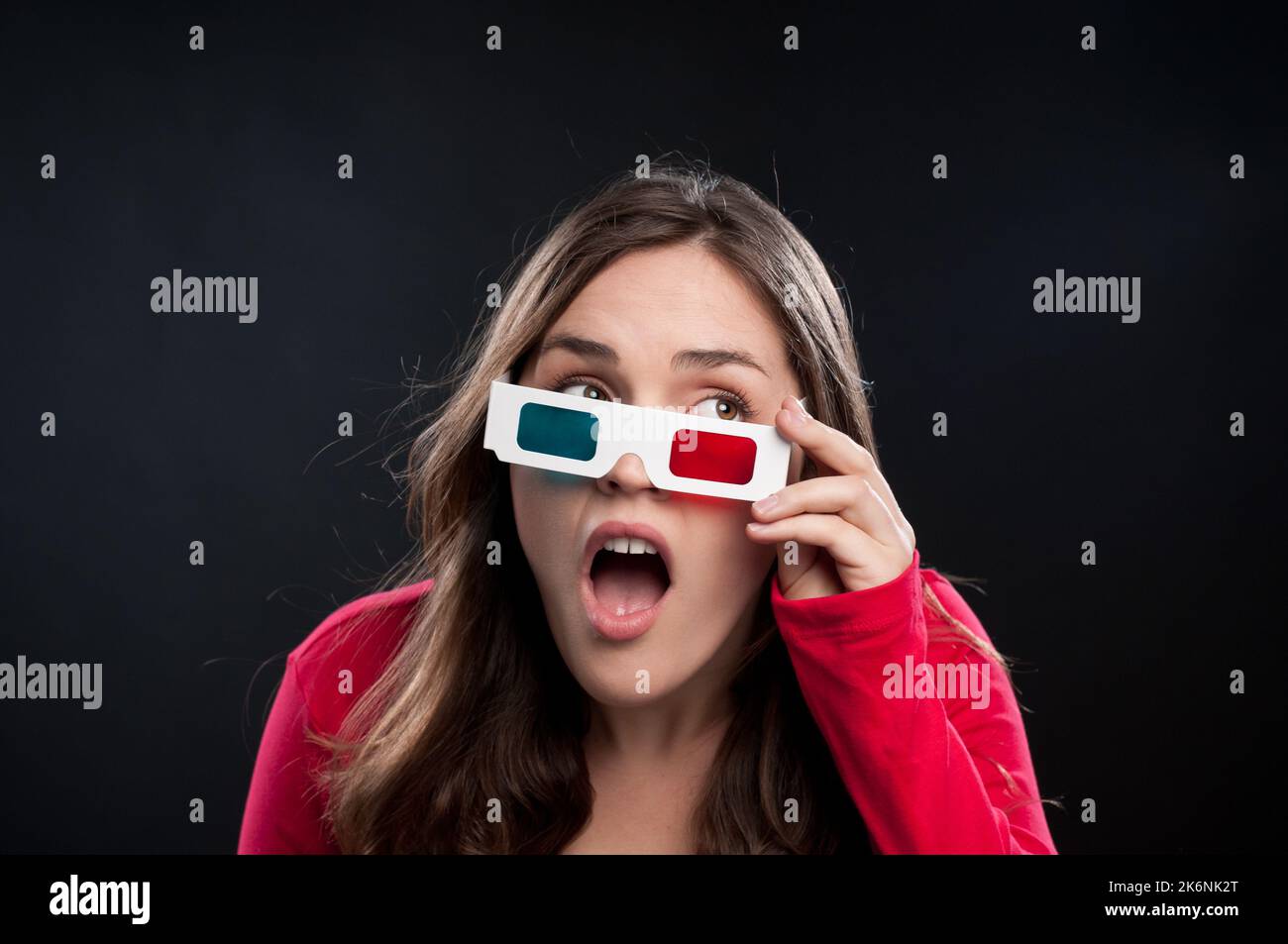 Viewing the world through a different lense. a young woman wearing 3D ...