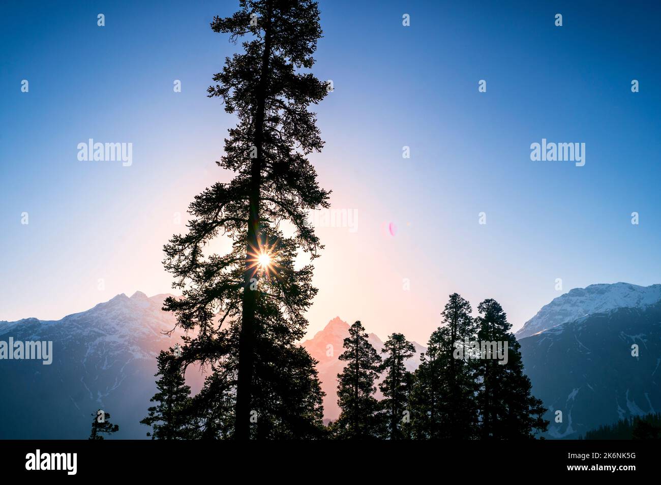 Sunrise in the mountain. Scenic meadows of the Parvati valley Himalayan ...