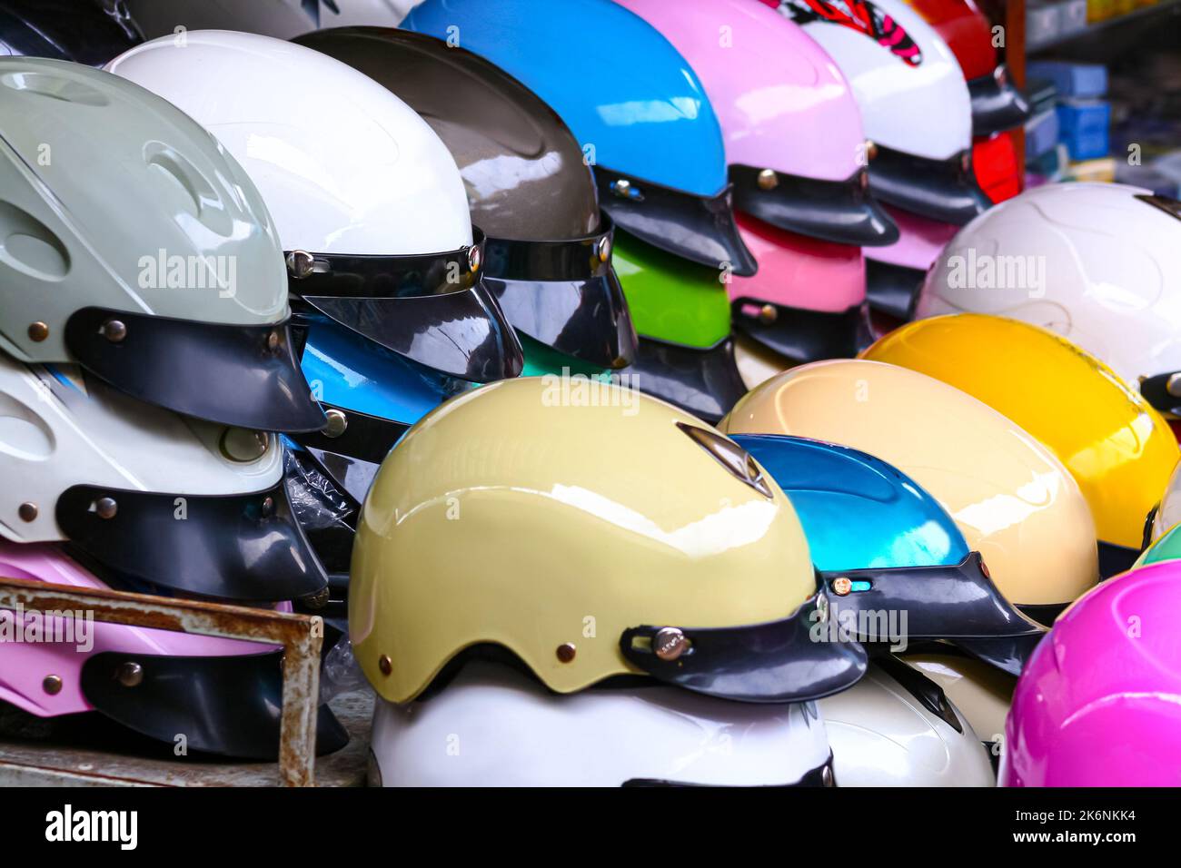Group of colorful helmets are sales on market Stock Photo - Alamy