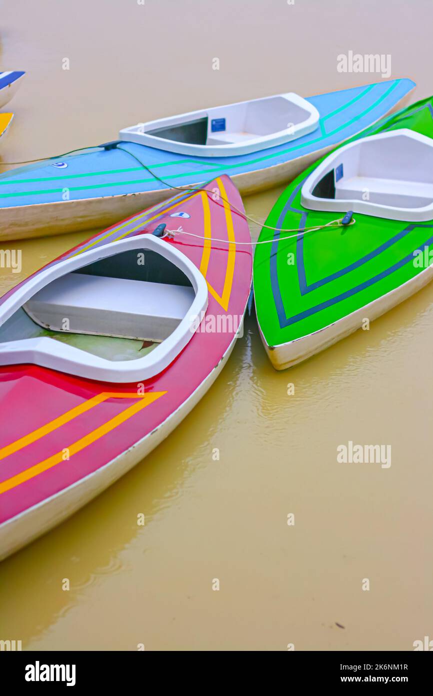 group of colorful canoe on calm lake in rainy day Stock Photo - Alamy