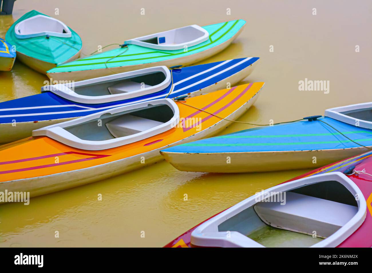 group of colorful canoe on calm lake in rainy day Stock Photo - Alamy