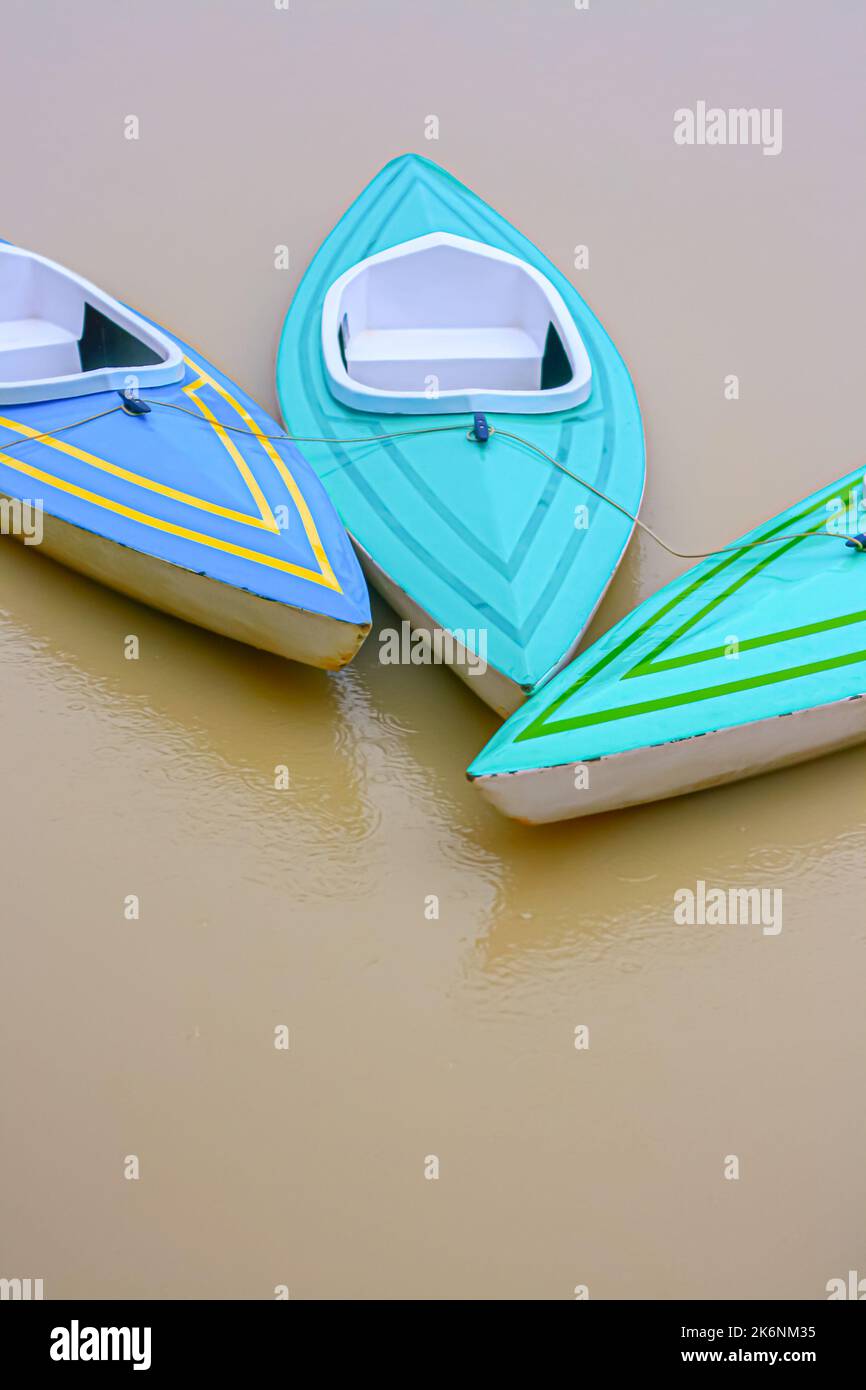 group of colorful canoe on calm lake in rainy day Stock Photo - Alamy