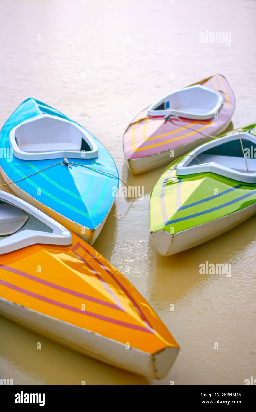 group of colorful canoe on calm lake in rainy day Stock Photo - Alamy
