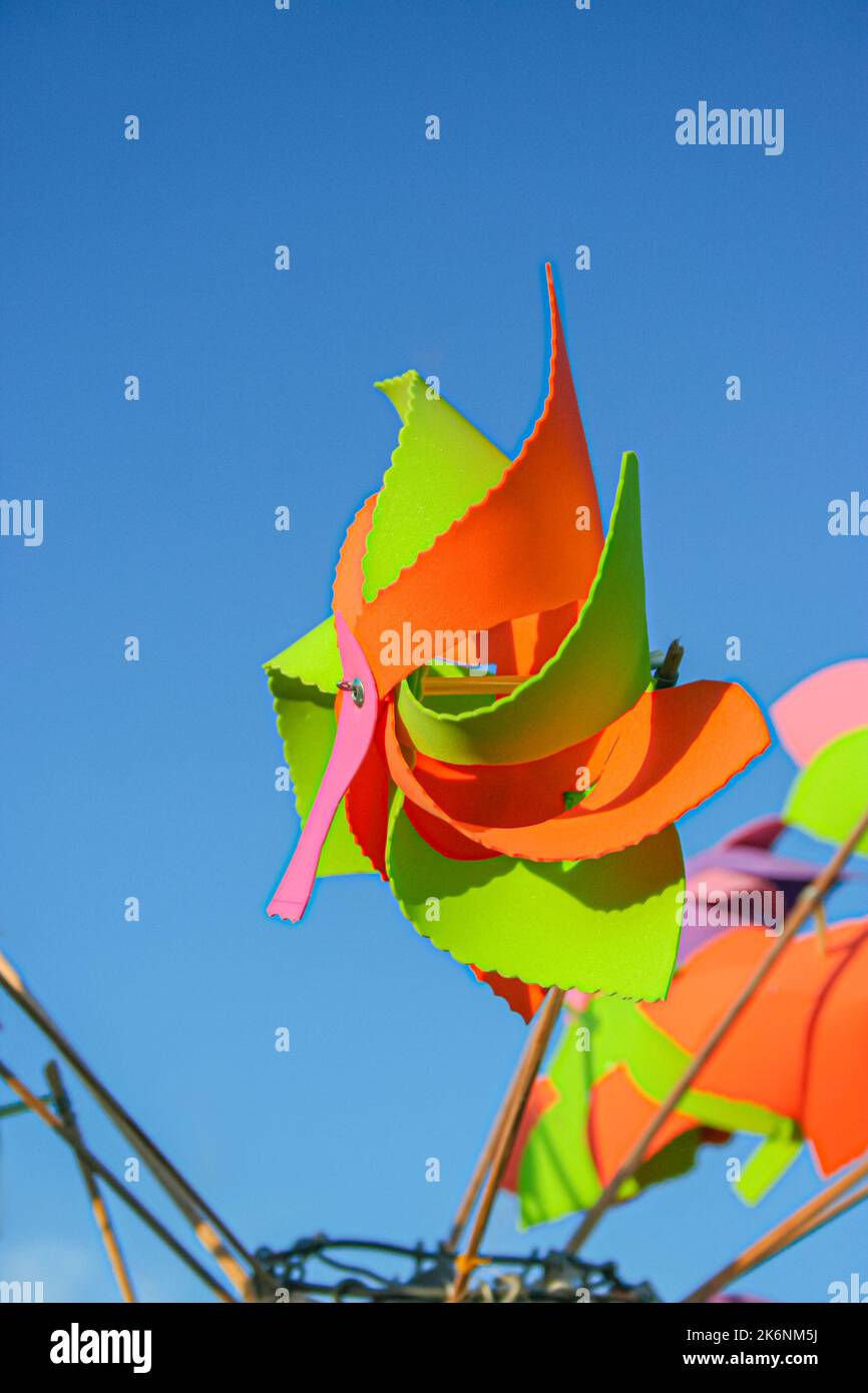 Colorful paper pinwheel craft under blue sky Stock Photo - Alamy