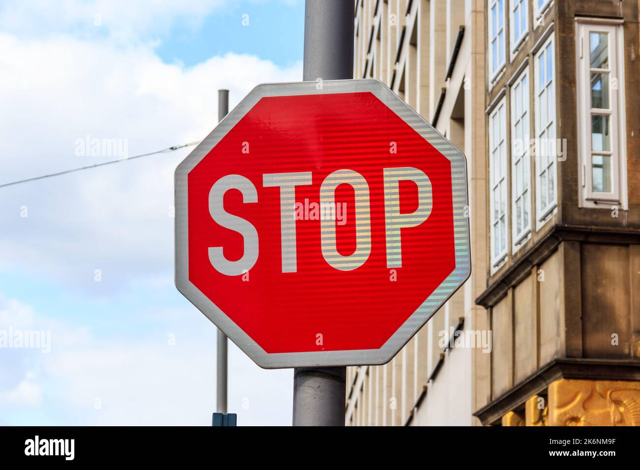Red Stop sign on a city street Stock Photo - Alamy
