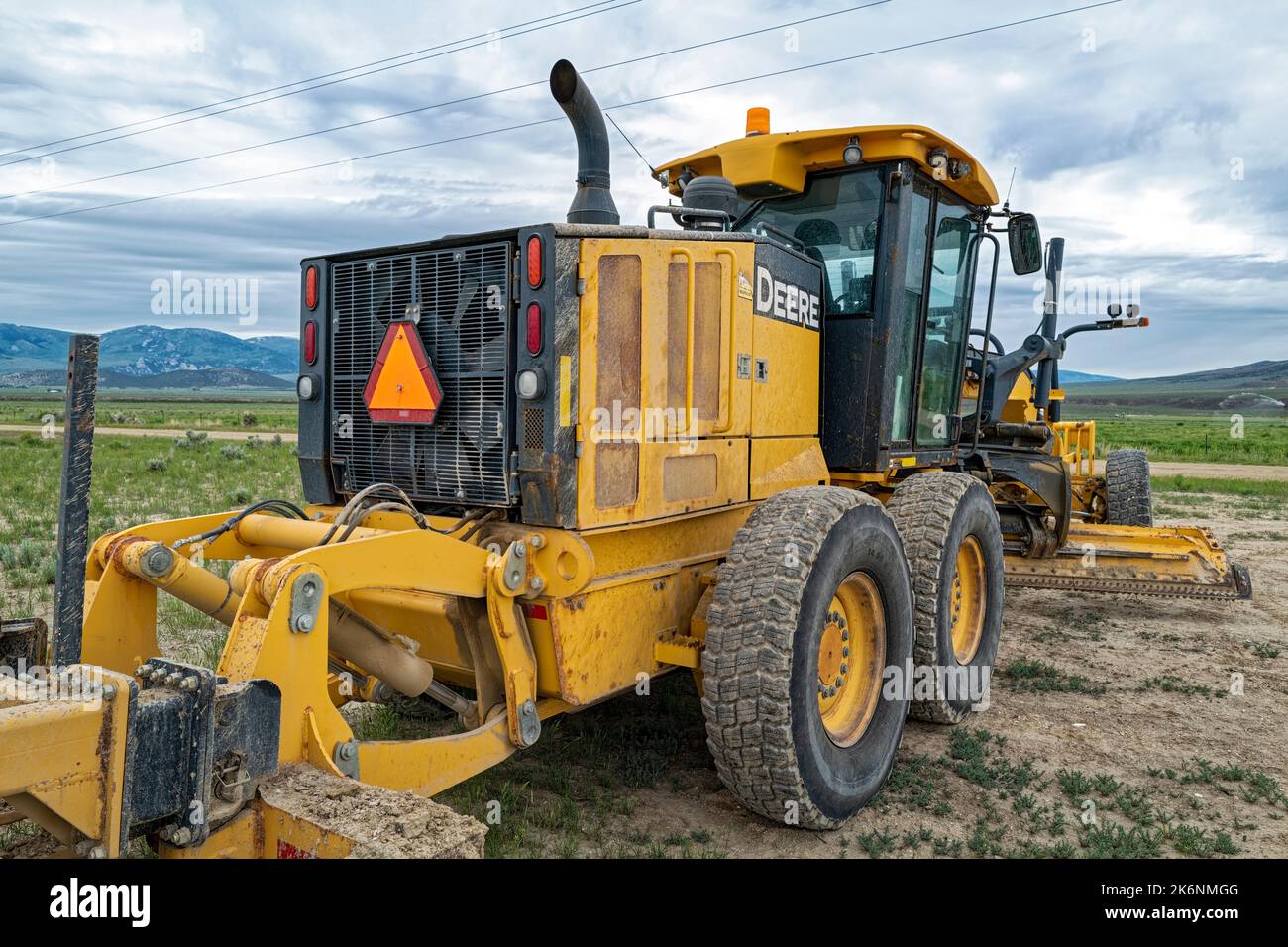 The rear engine compartment on a John Deere 772GP Grader parked at a ...