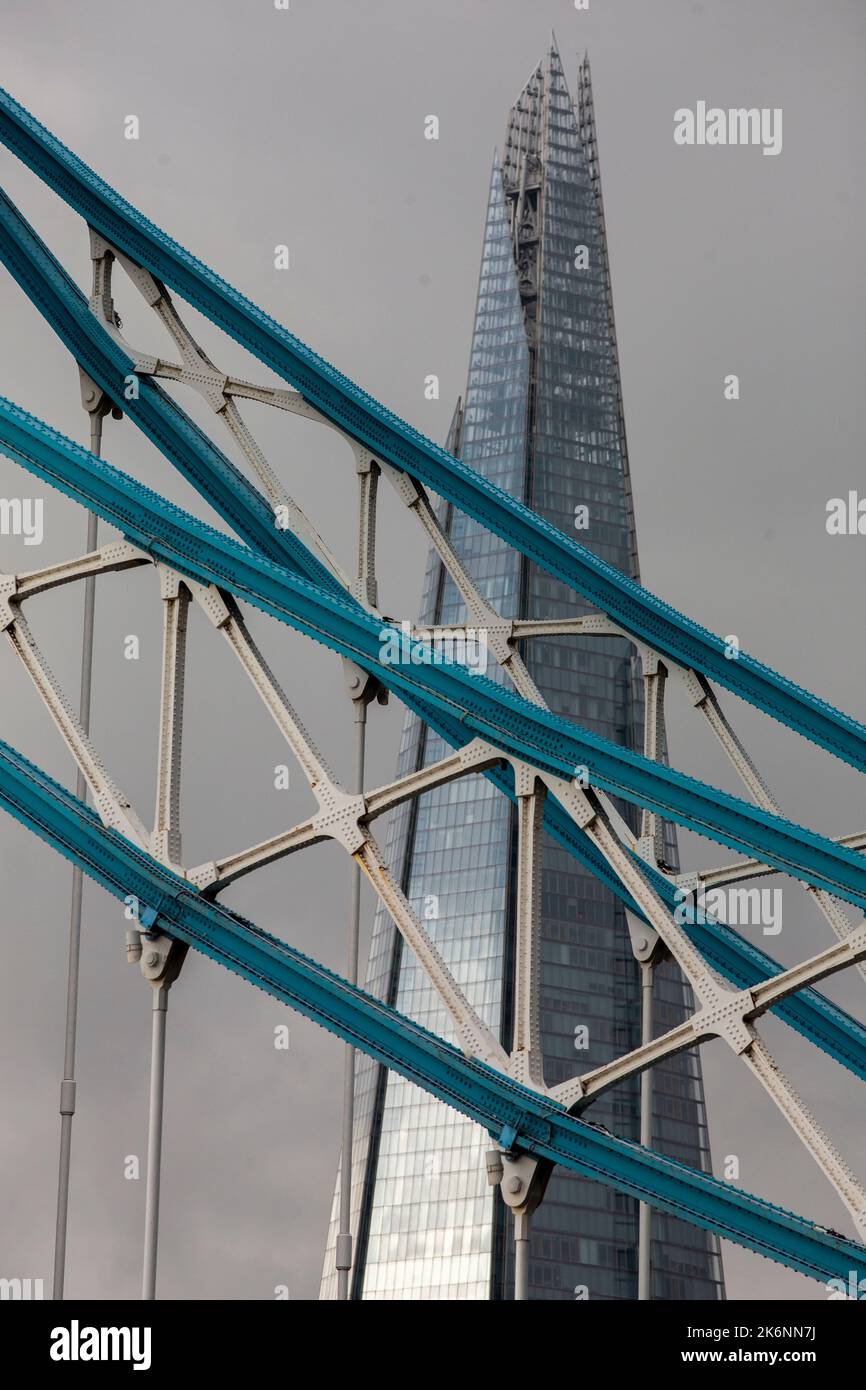 The Shard seen through the metal work of Tower Bridge London, UK Stock ...