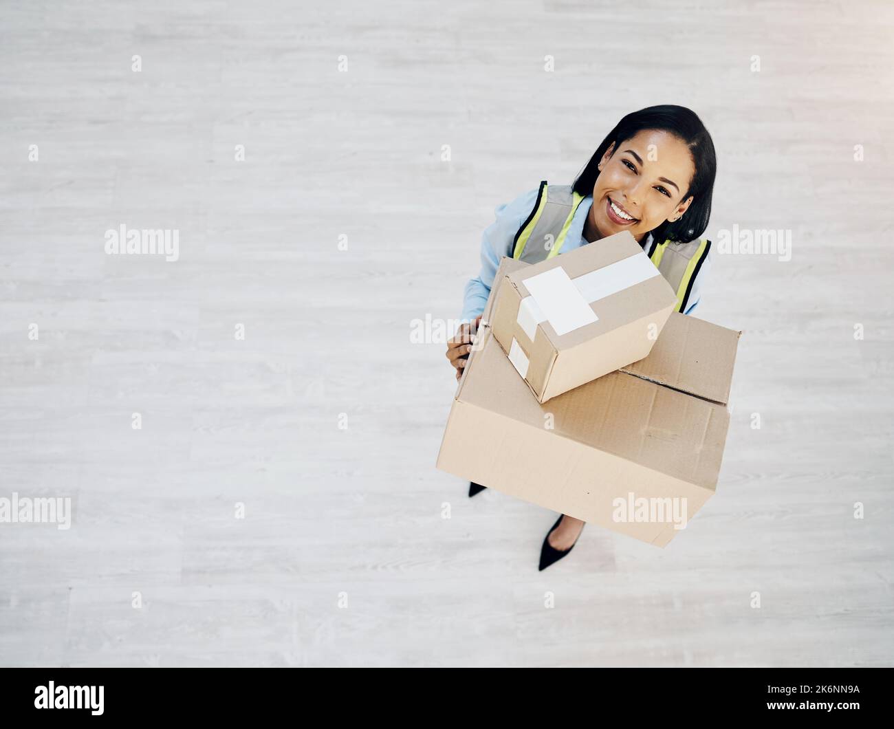 Your order has been processed. High angle shot of a young woman holding ...