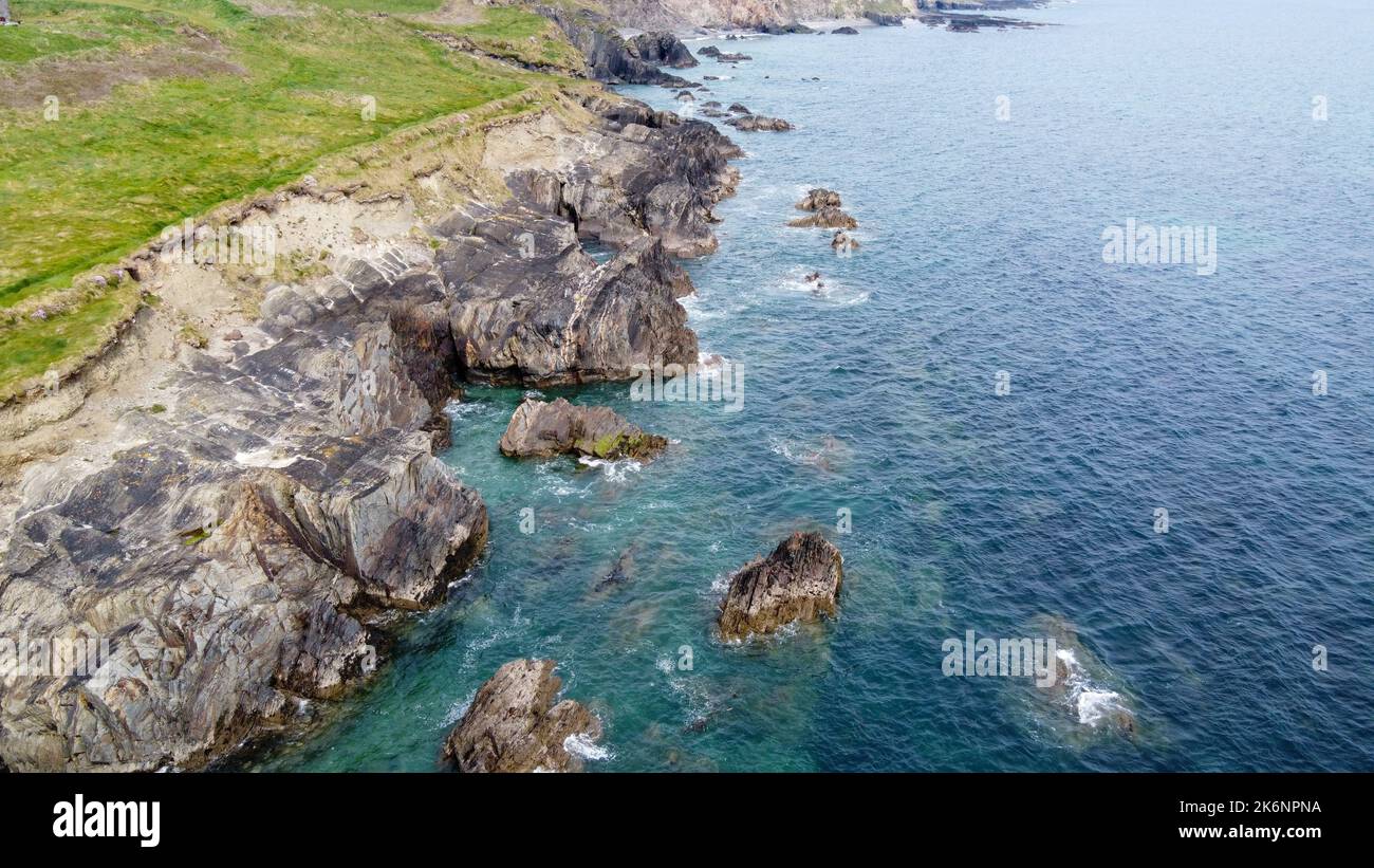 Beautiful sea water near steep coastal cliffs. The nature of Ireland ...
