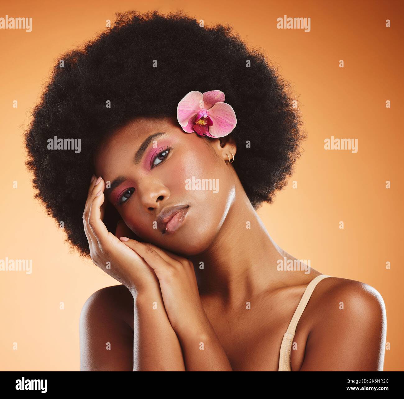 Black woman, beauty and makeup, skin and face with flower, hair and ...