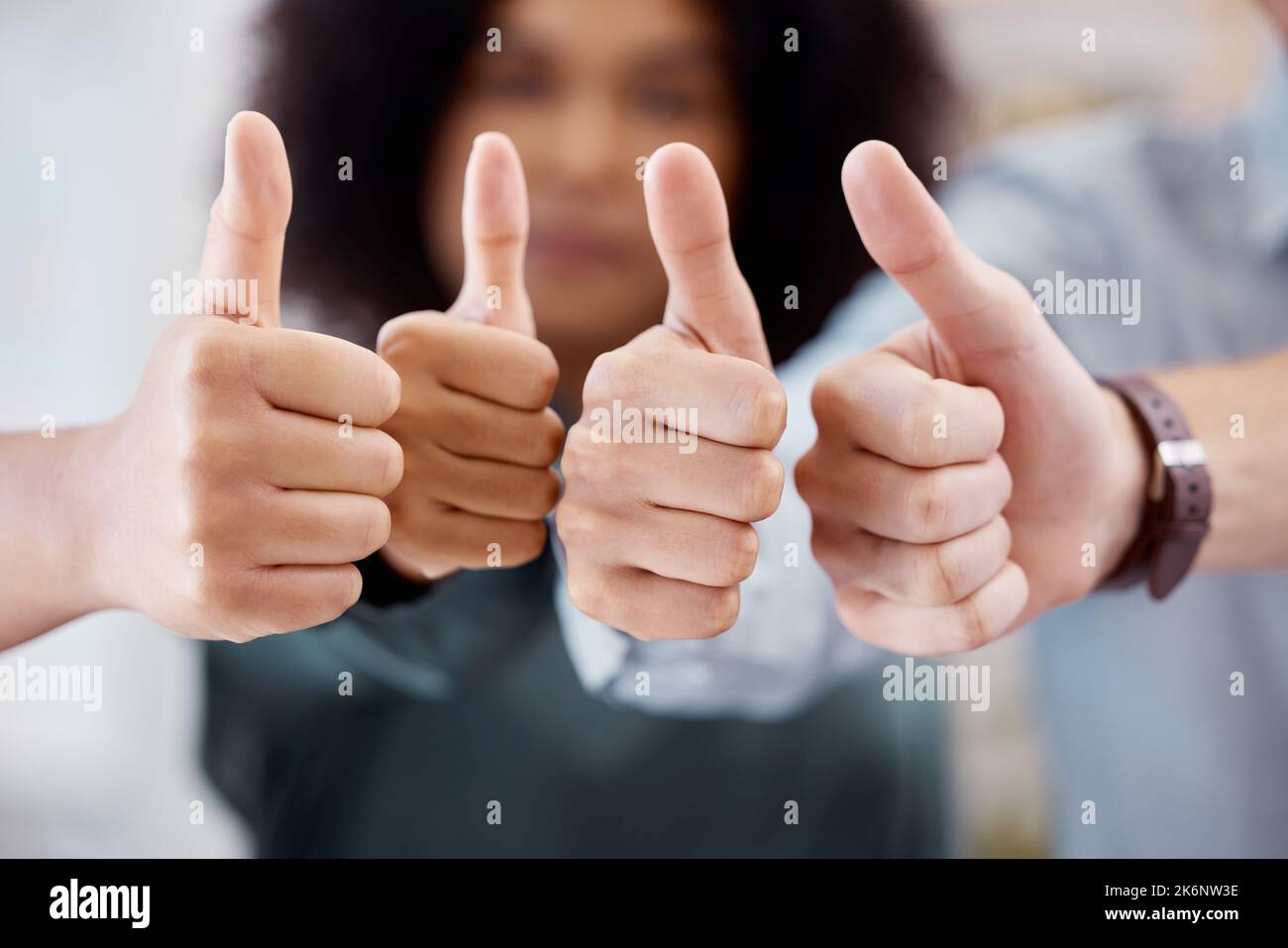 Thumbs up, support and business people in collaboration for a thank you, agreement or success ...