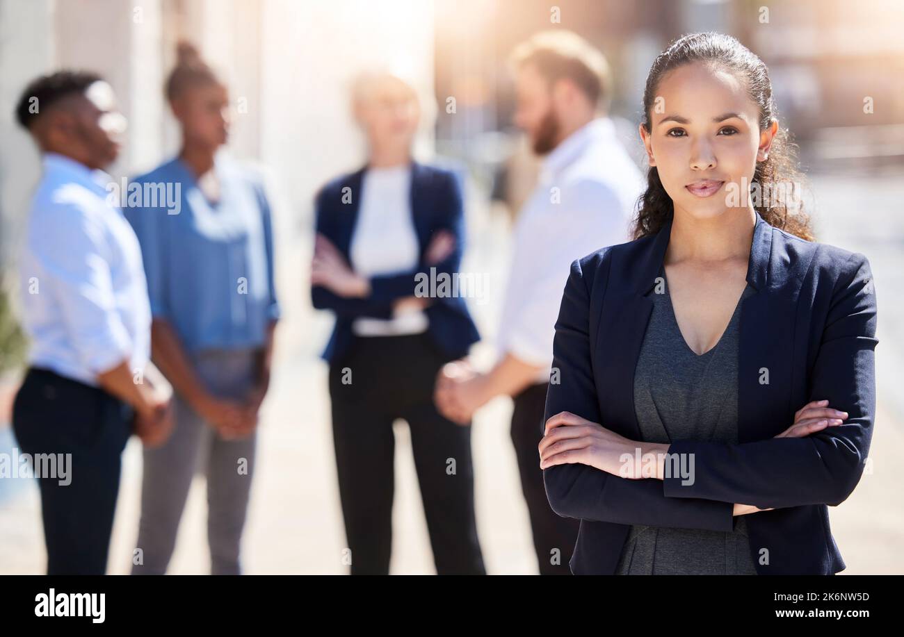 Weve got to talk business. a young businesswoman standing with her arms ...