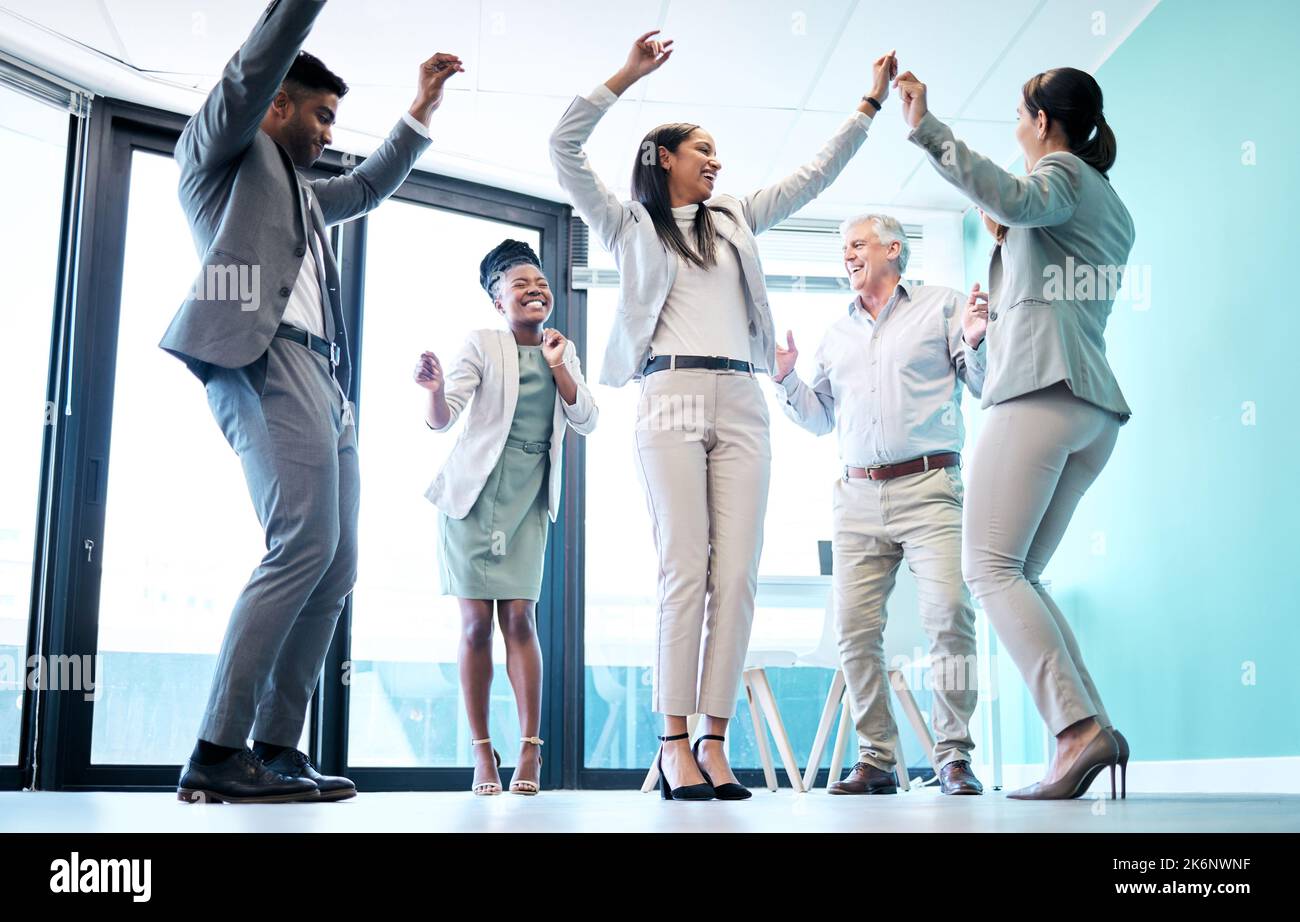 Party time. Full length shot of a diverse group of corporate ...