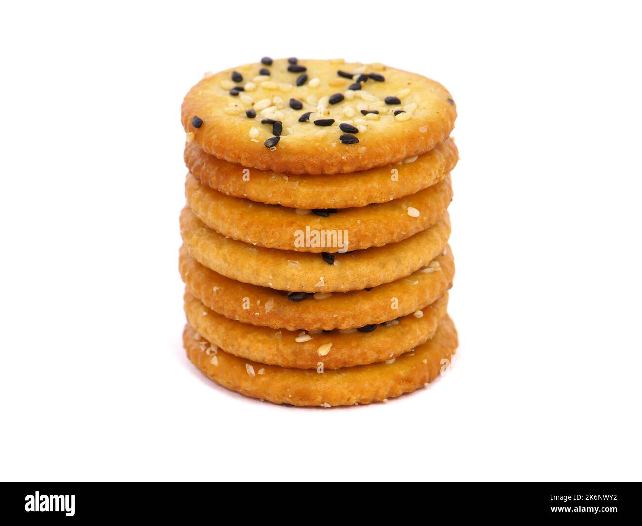 Pile of round sesame crackers isolated on white Stock Photo - Alamy