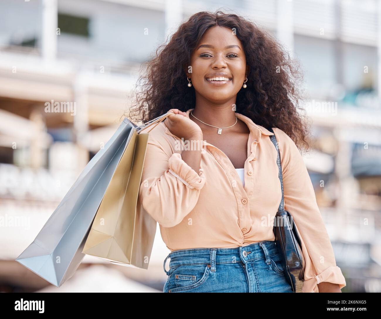 Happy, city and black woman shopping for fashion, customer discount ...