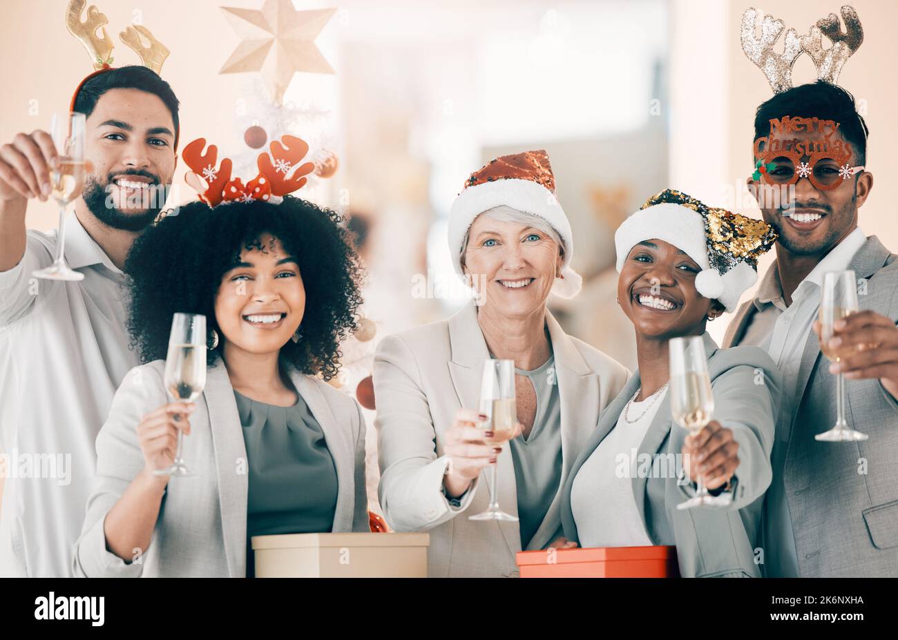 Cheers to a great year. a group of businesspeople celebrating while ...