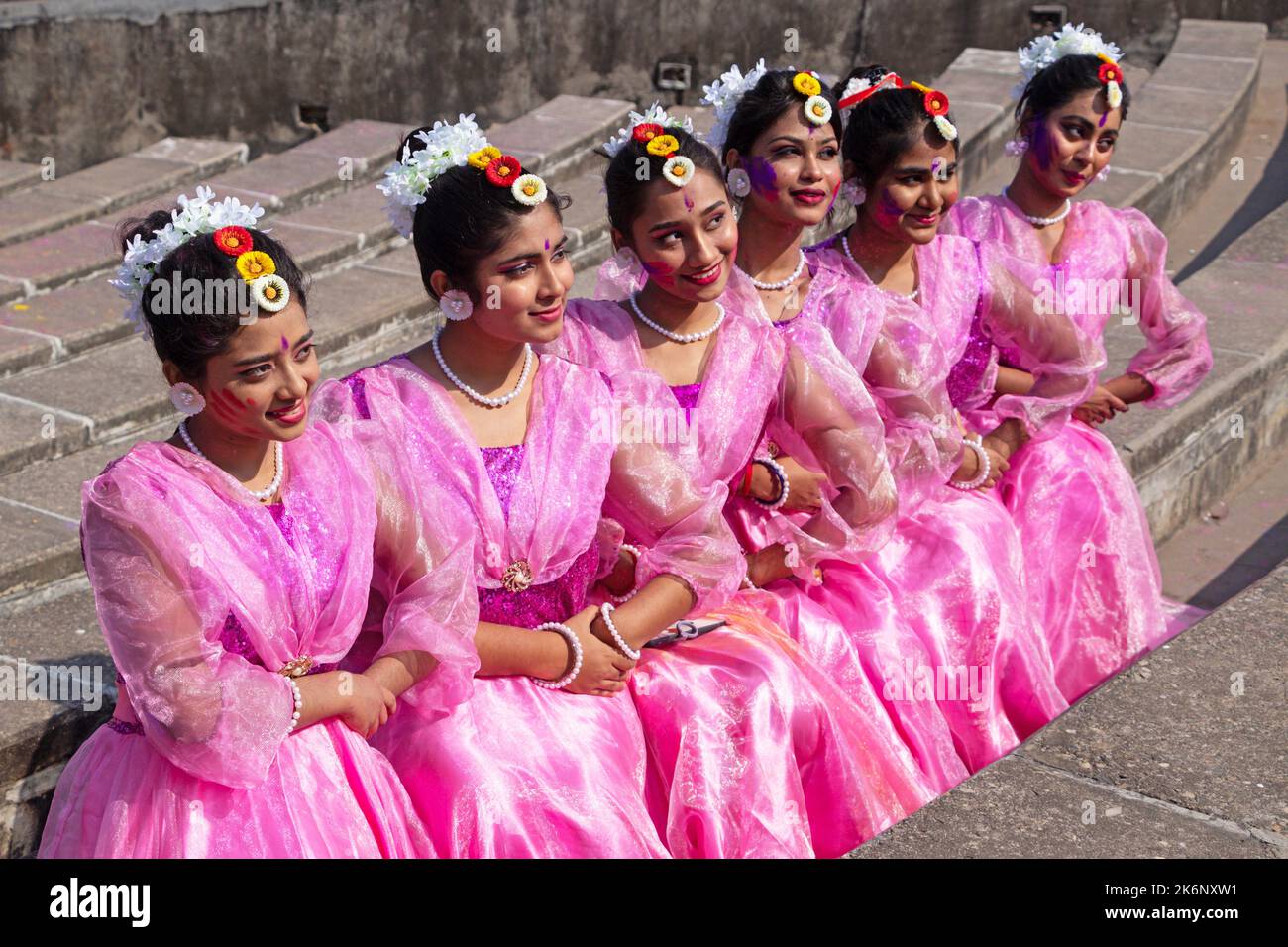 Women wear traditional dresses with floral ornaments and perform during ...