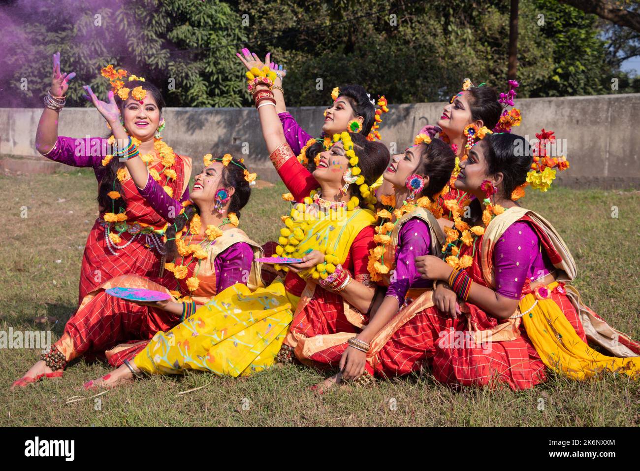 Women wear traditional dresses with floral ornaments and perform during ...