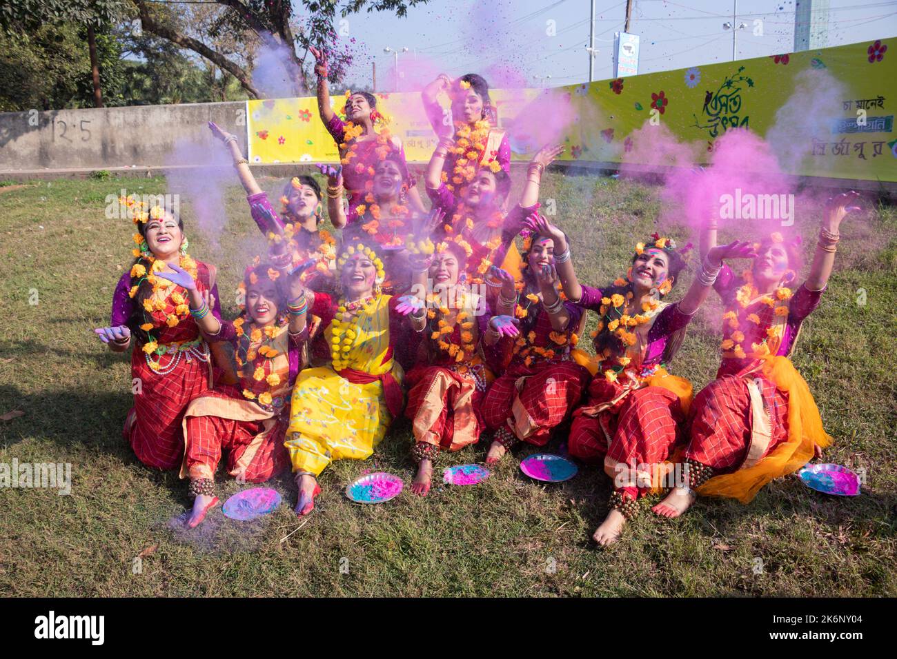 Women wear traditional dresses with floral ornaments and perform during ...